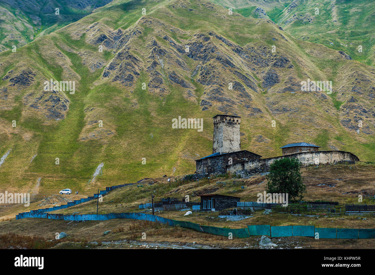 Village Ushguli landscape with massive rocky mountains Bezengi wall ...