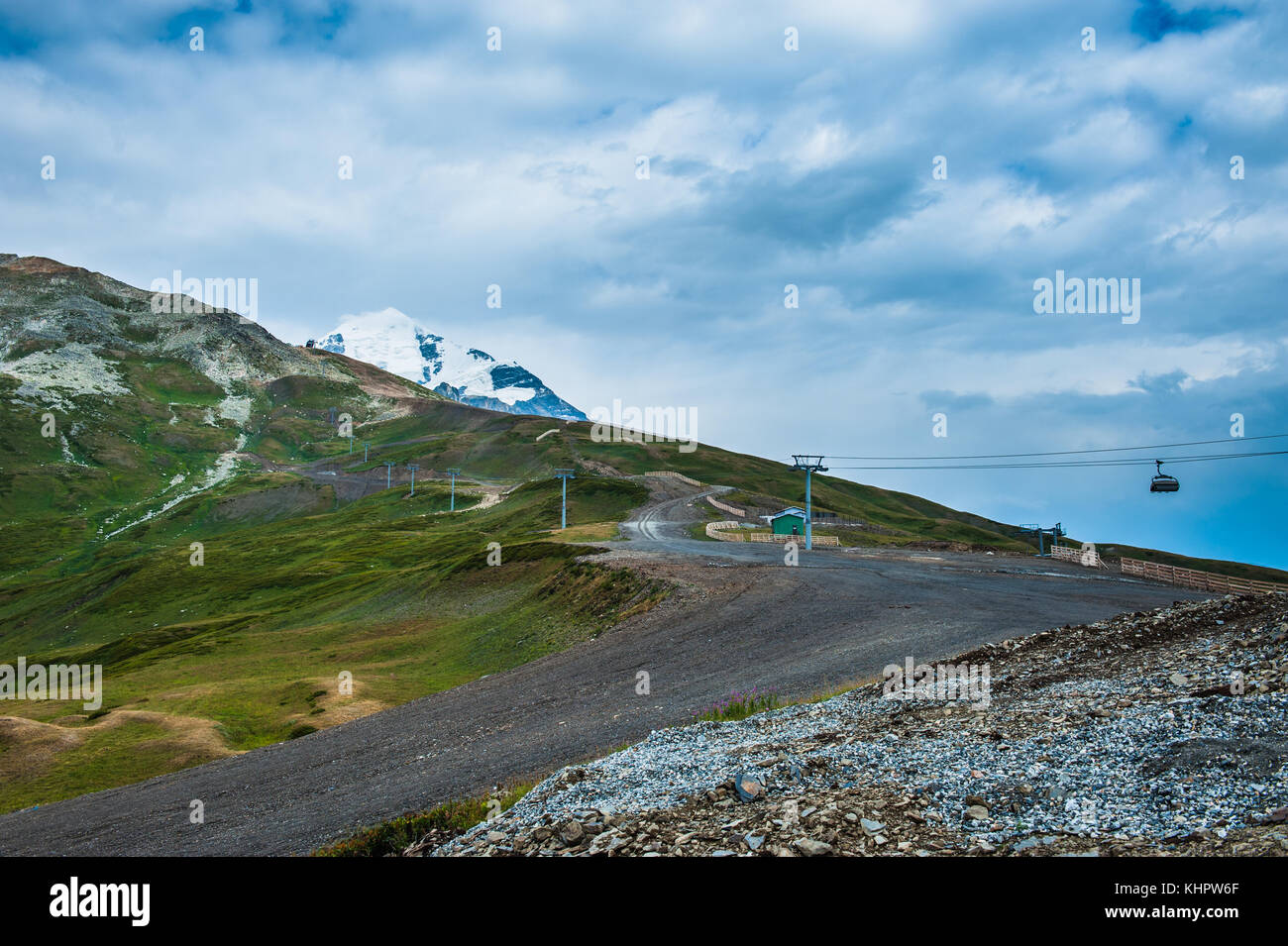 Mountain valley with snow peaks and clouds in Tetnuldi, Mestia, Georgia ...