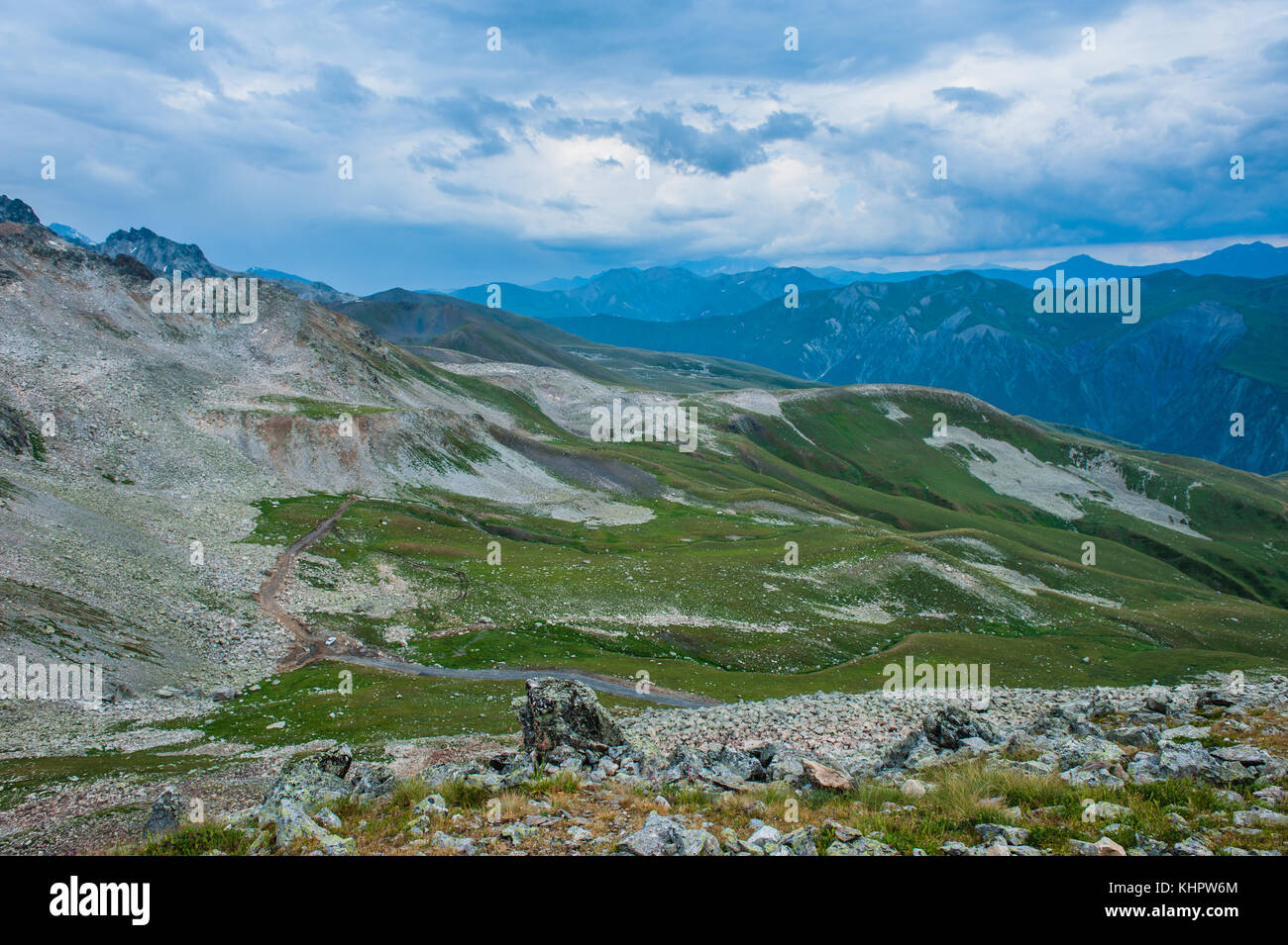 Mountain valley with snow peaks and clouds in Tetnuldi, Mestia, Georgia ...