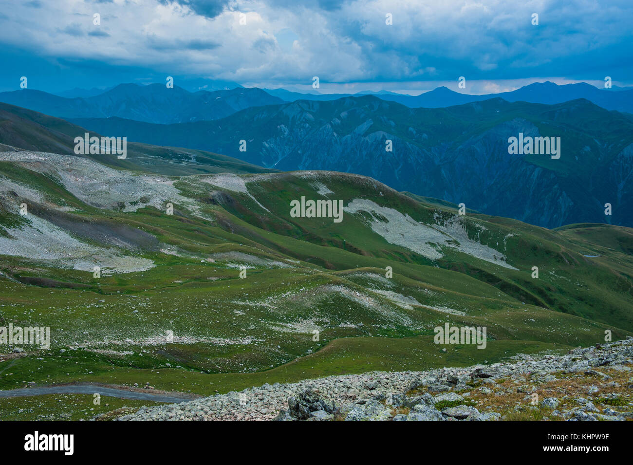 Mountain valley with snow peaks and clouds in Tetnuldi, Mestia, Georgia ...
