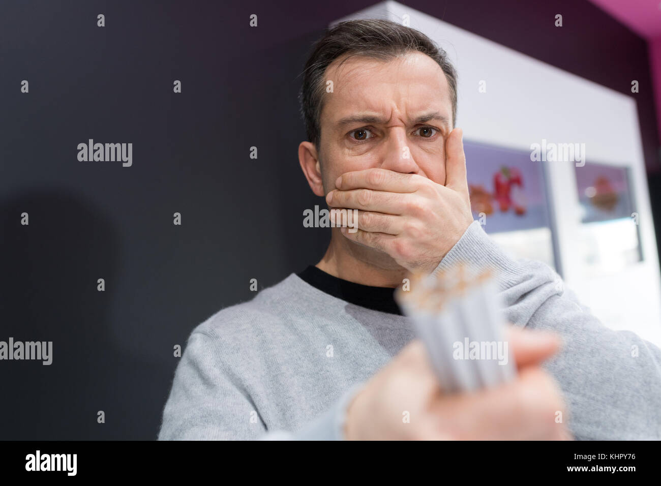 portrait of man sick looking at cigarettes Stock Photo - Alamy