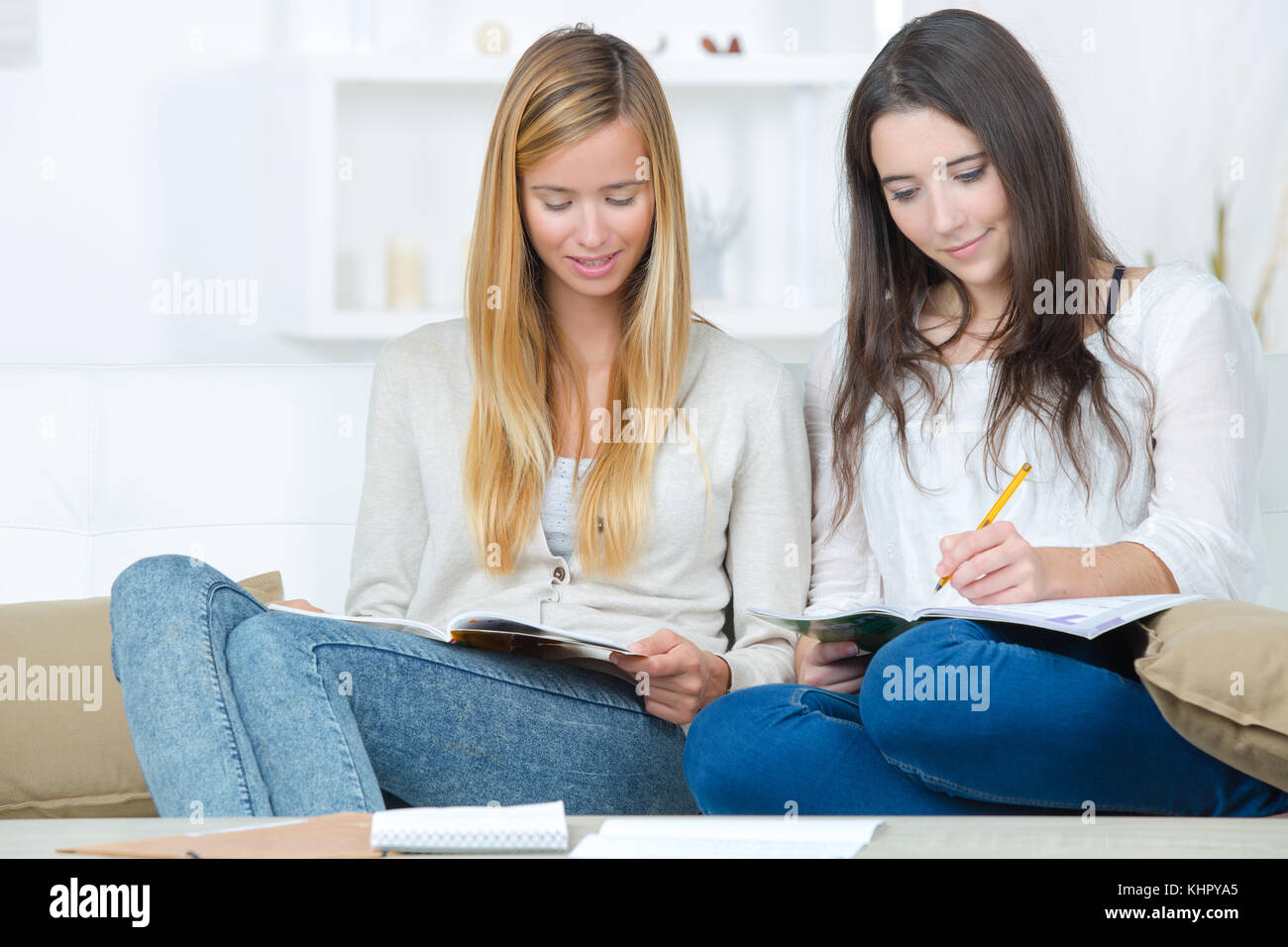 friends doing their assignment Stock Photo - Alamy