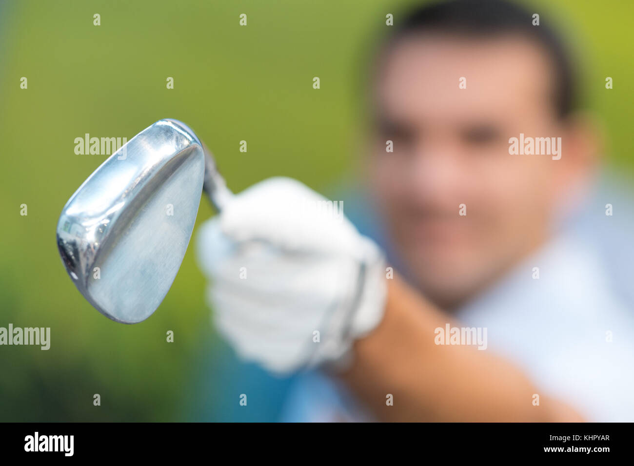 golfer and club ready tee off Stock Photo - Alamy