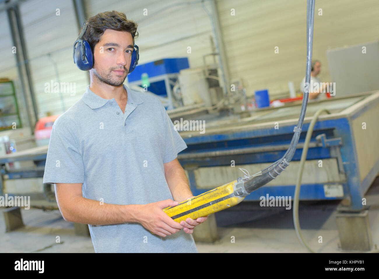 Man using suspended control pad Stock Photo - Alamy