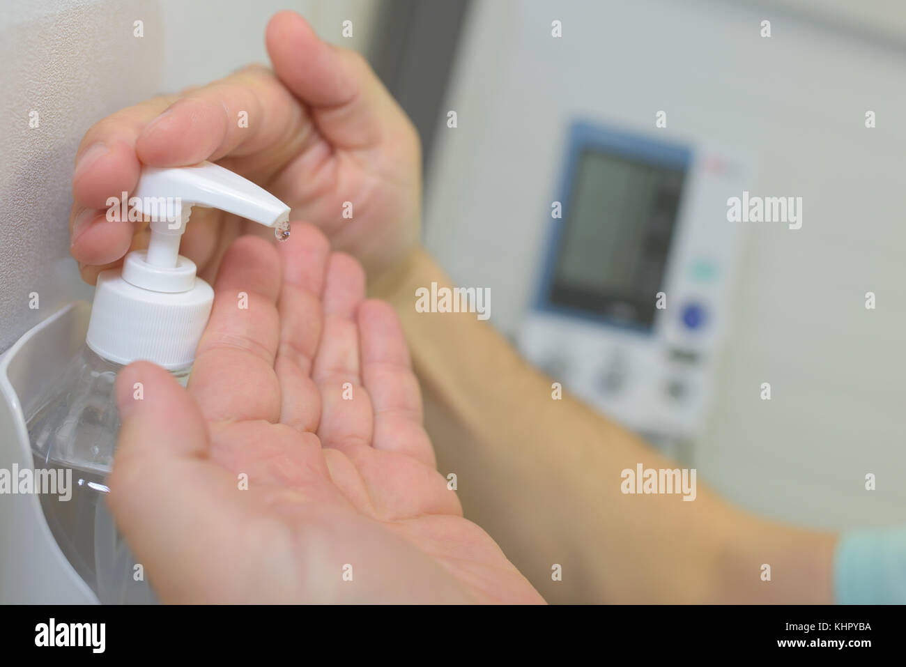 soap dispenser with a hand pushing on it Stock Photo - Alamy