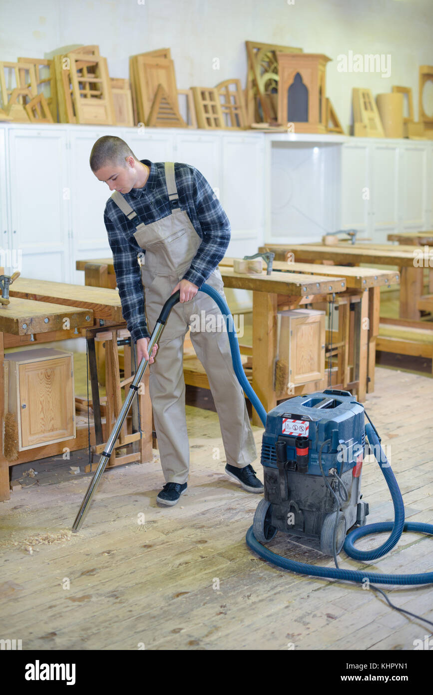carpenter cleaning the floor Stock Photo - Alamy