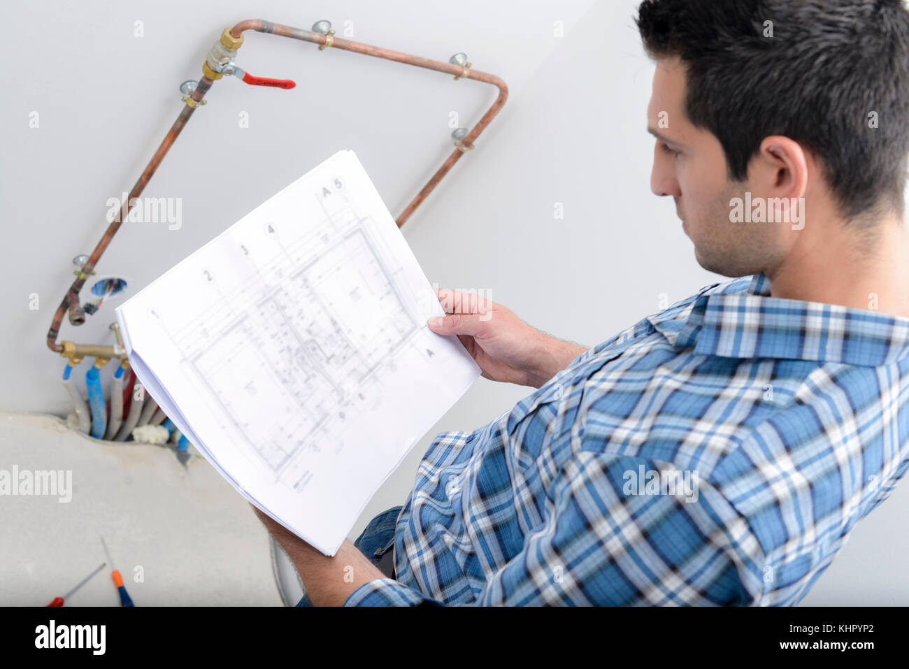 Plumber at work Stock Photo - Alamy