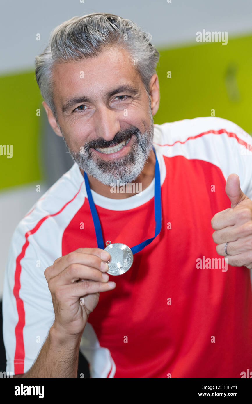 man wearing silver medal Stock Photo - Alamy