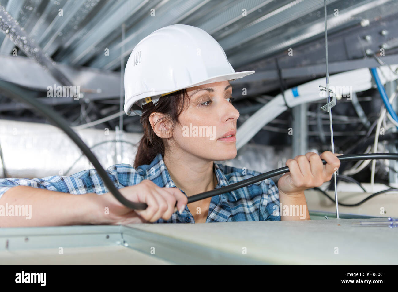 female electrical engineer working with wires Stock Photo - Alamy