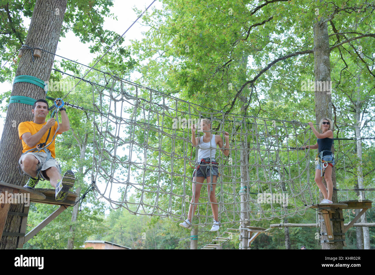 on the ropes in adventure park Stock Photo - Alamy