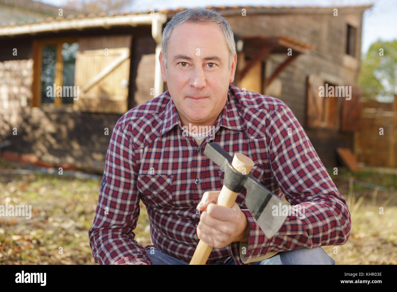 Man holding axe hi-res stock photography and images - Alamy