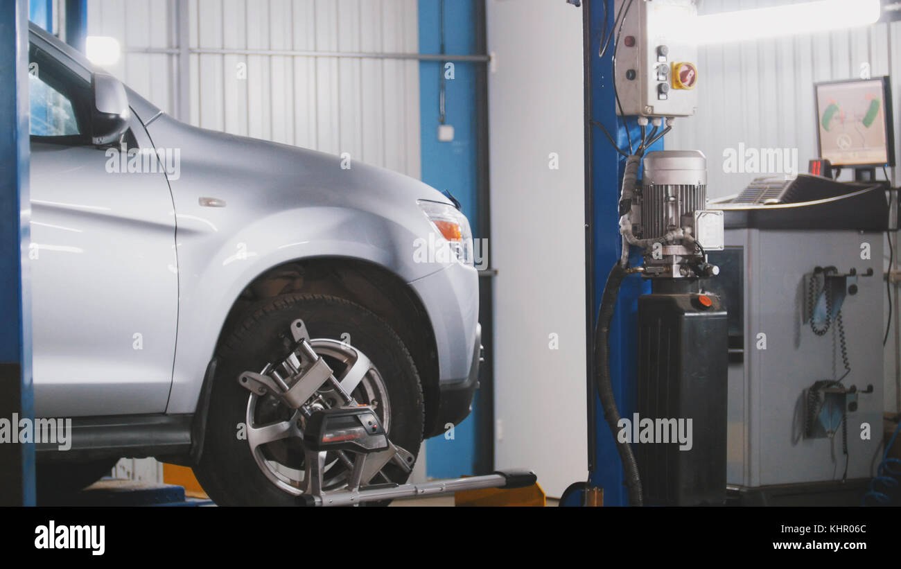 Checking the wheel in garage automobile service, close up Stock Photo ...