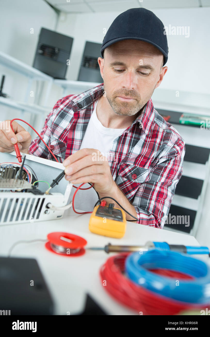 man repairing radiator Stock Photo - Alamy