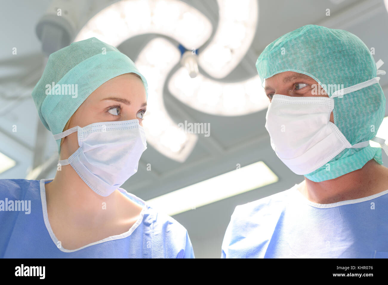 surgeons talking to each other in operation room at hospital Stock ...