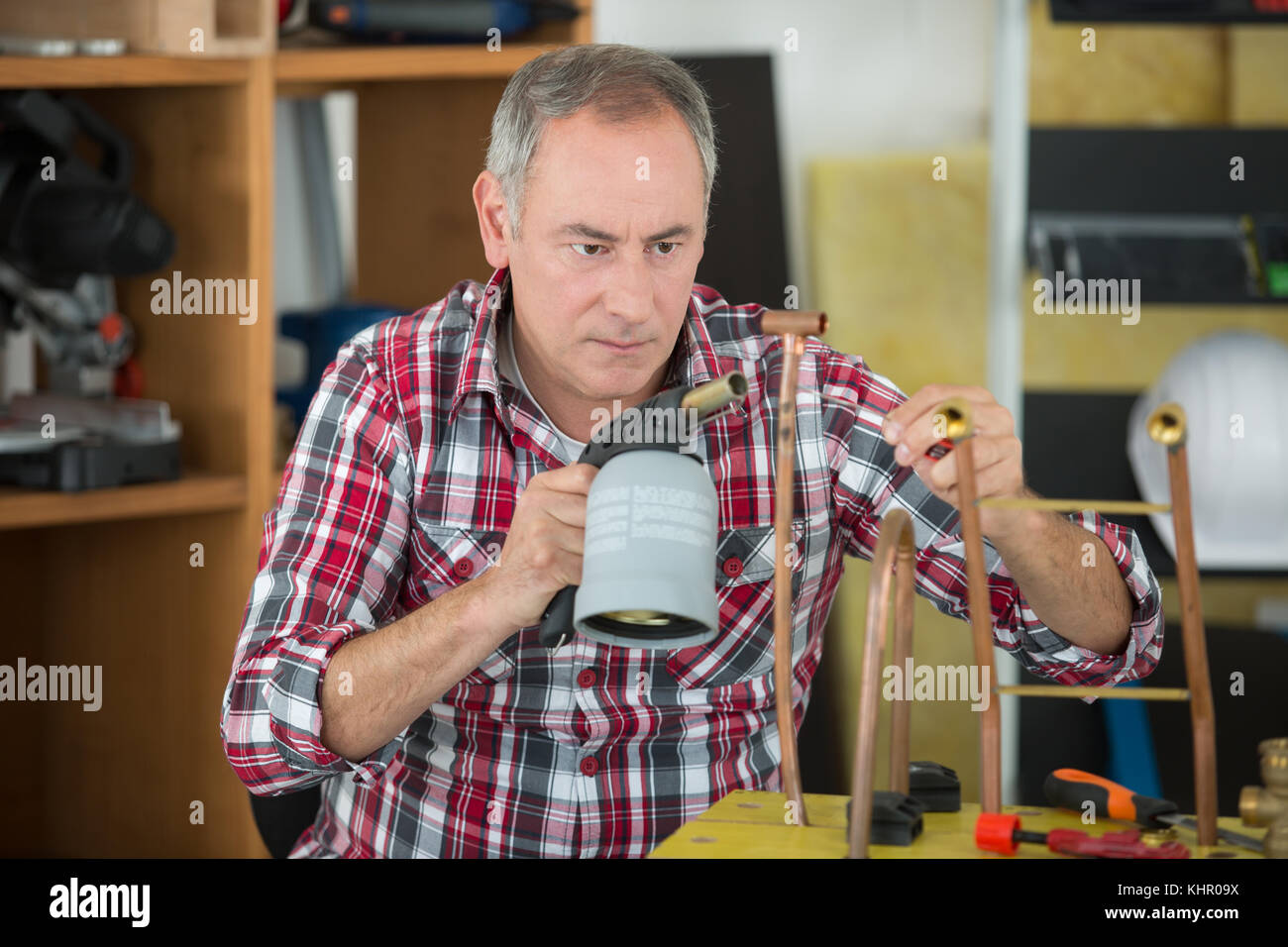 worker using a blowtorch Stock Photo - Alamy