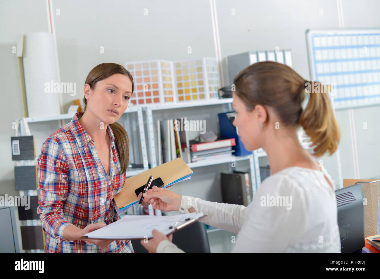 Handing over a document Stock Photo - Alamy