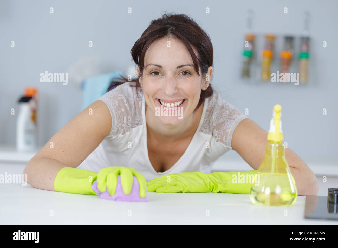 pretty housewife finished cleaning the kitchen Stock Photo - Alamy