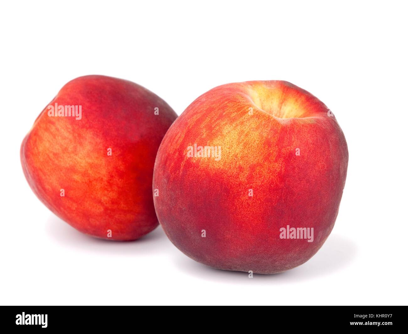 Two peaches on a white background Stock Photo - Alamy