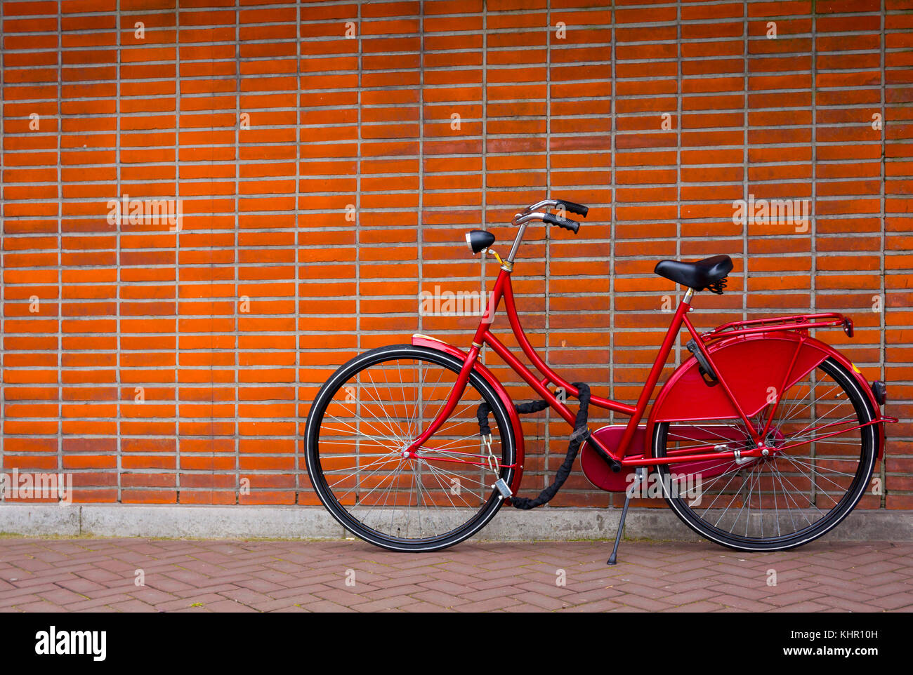 Traditional dutch bicycle parked on near brick wall in Amsterdam Stock ...