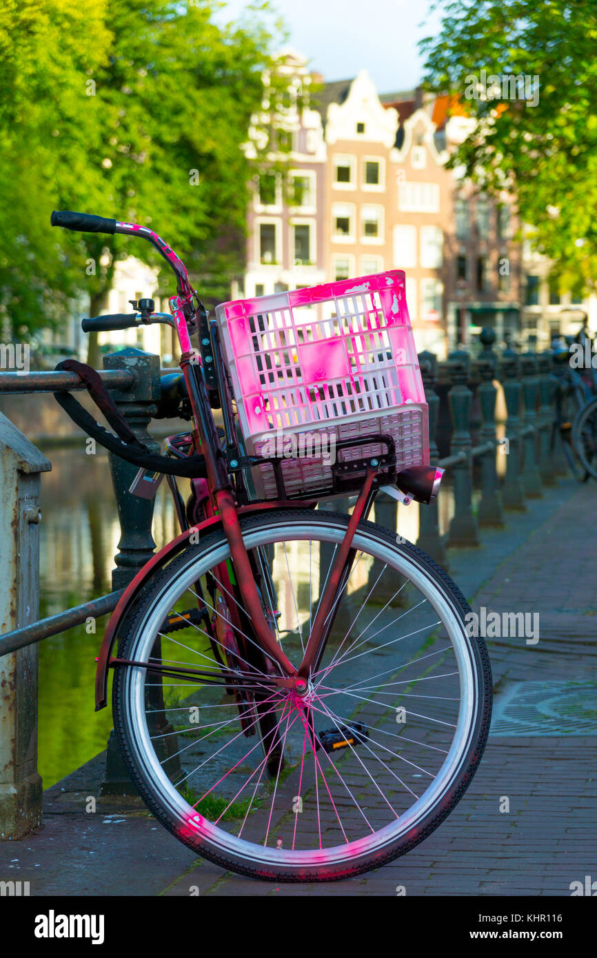 Traditional dutch bicycle parked on canal in Amsterdam Stock Photo - Alamy