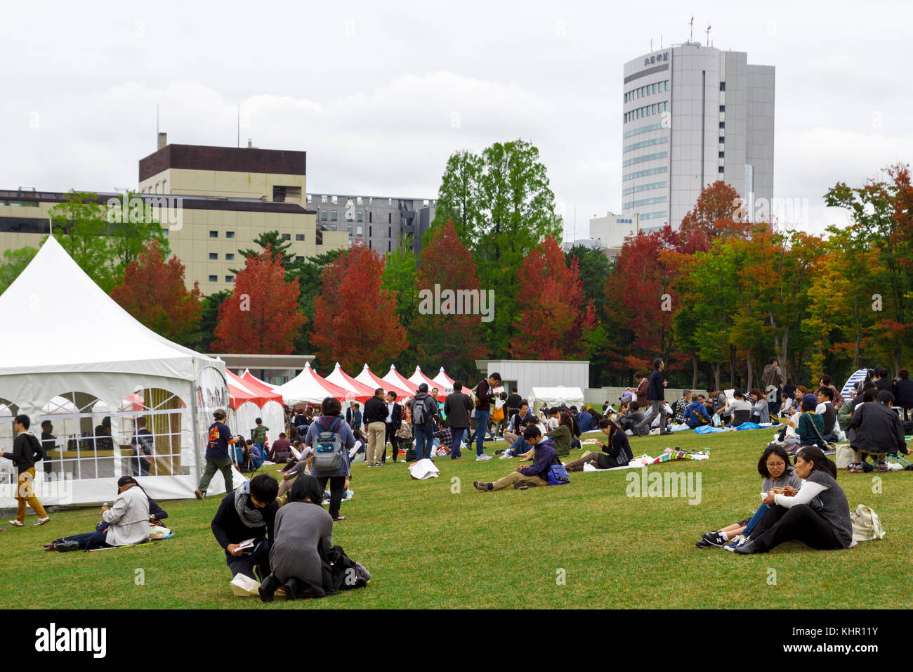 Japanese people relaxing and having fun in a public park of Kanazawa ...