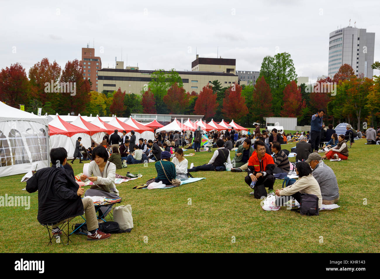 Japanese people relaxing and having fun in a public park of Kanazawa ...
