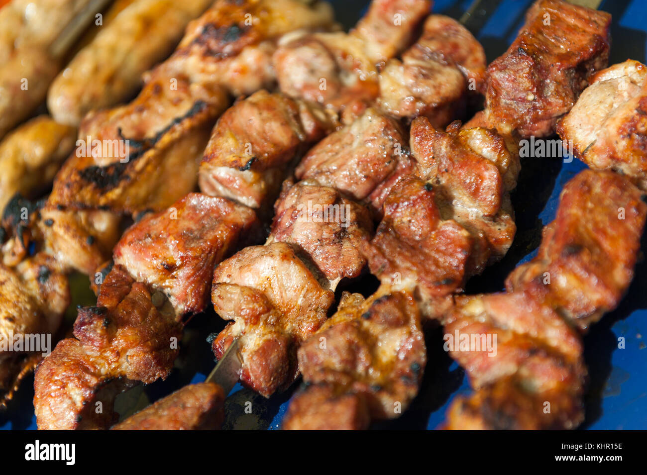 Prepared shashlik, lamb meat grilling on metal skewer and grilled ...
