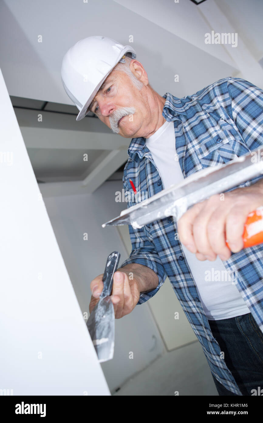 man making home walls renovation Stock Photo - Alamy