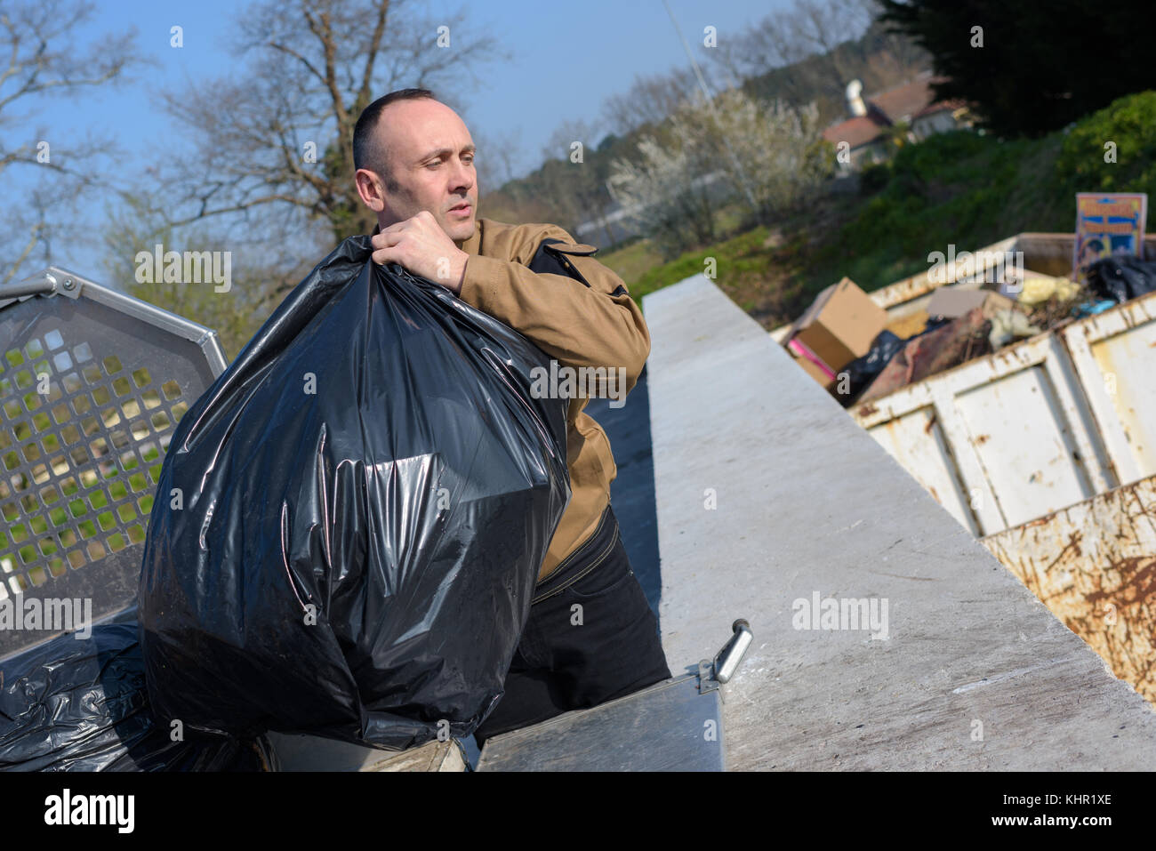 garbage worker collecting plastic bags Stock Photo - Alamy