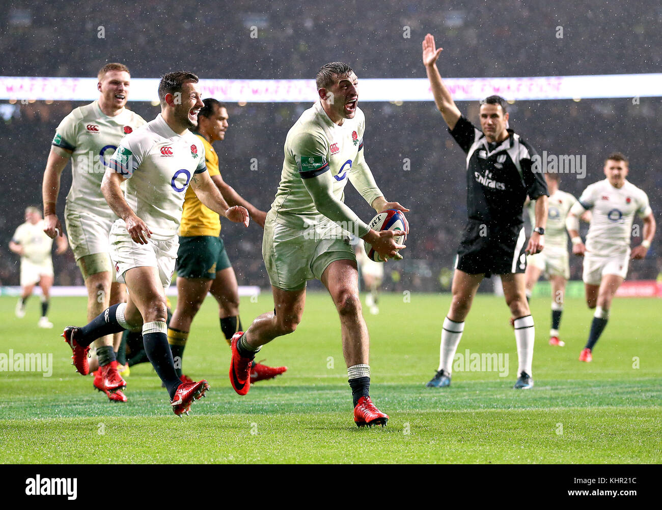 England's Jonny May celebrates scoring his side's third try during the ...