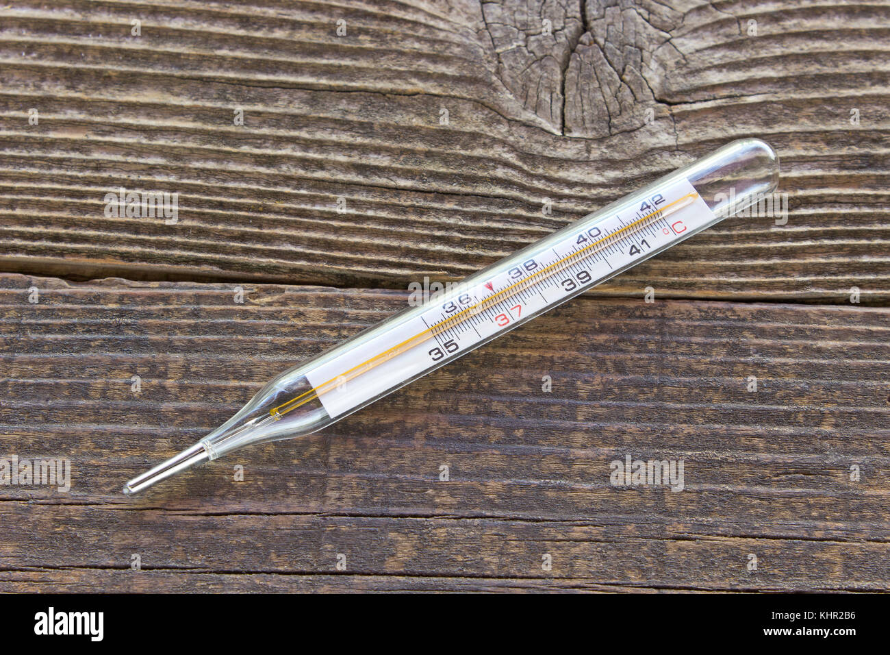 Medical thermometer on old wooden background Stock Photo - Alamy