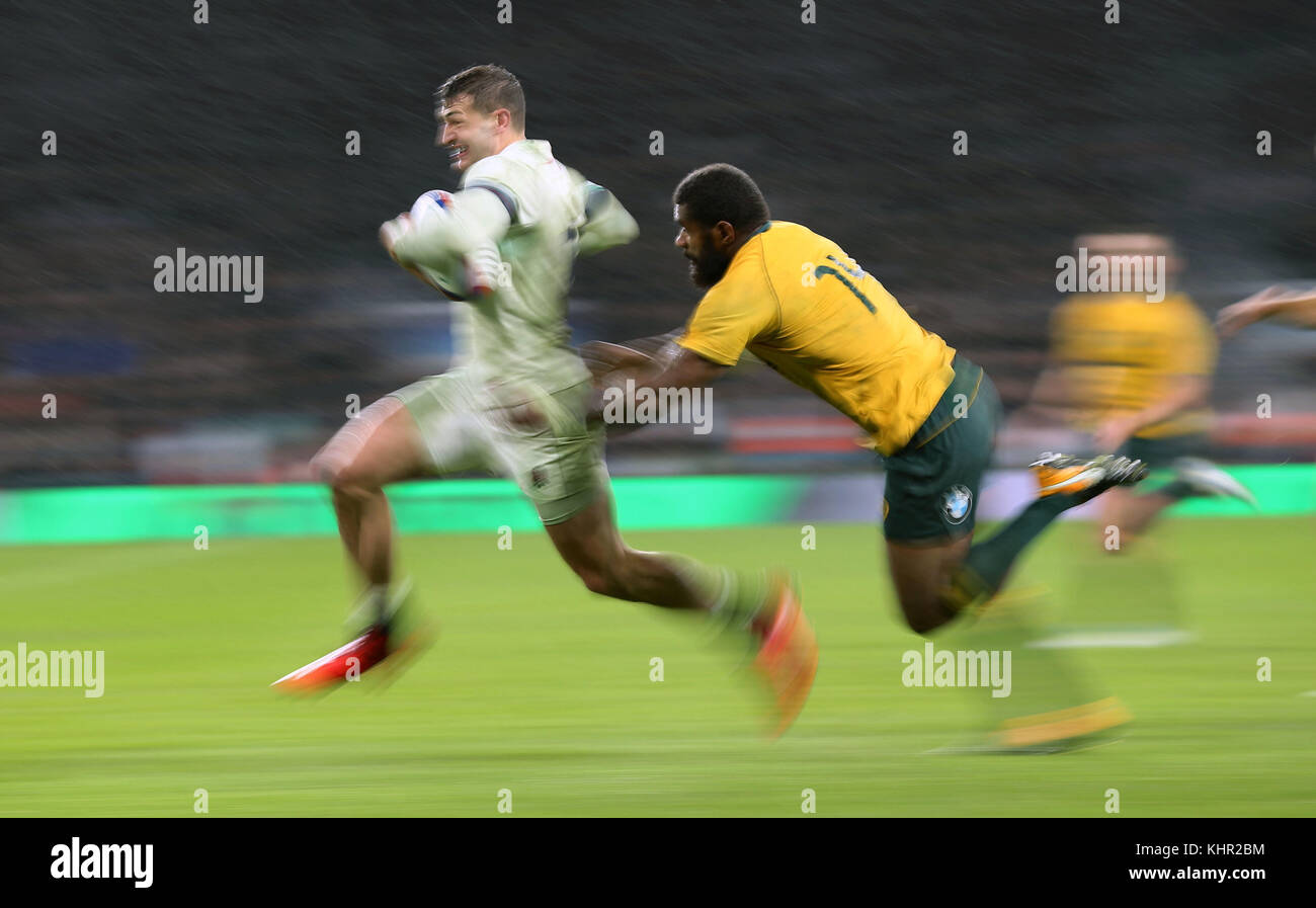 England's Jonny May is tackled by Australia's Marika Koroibete during ...