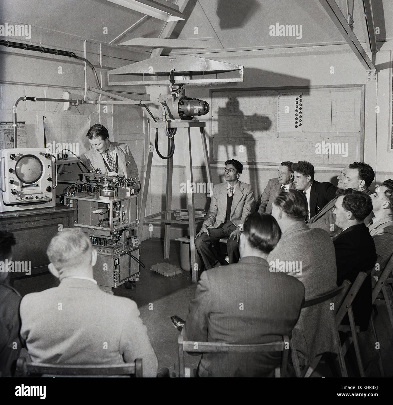 1950s, historical,a group of aviation engineers in a sitting inside a ...