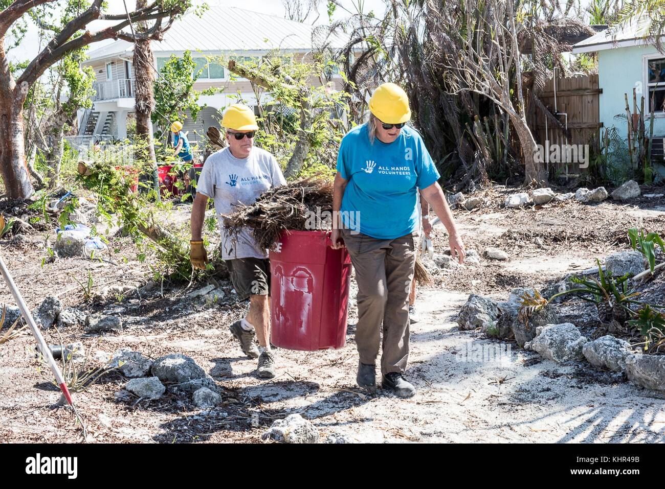 All Hands Volunteers clean up debris during relief efforts in the ...