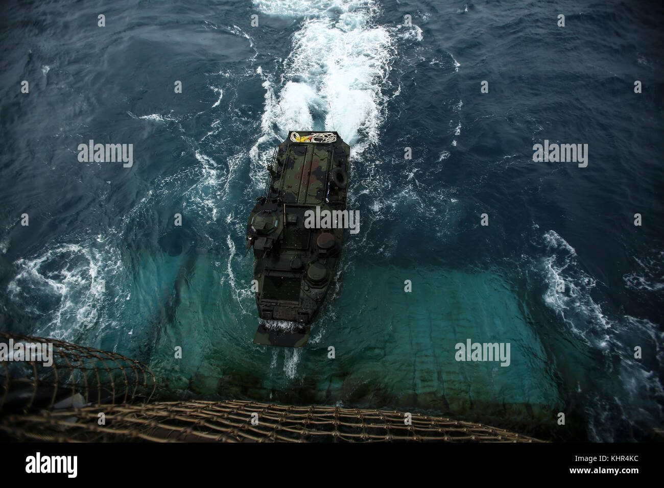 A U.S. Marine Corps amphibious assault vehicle enters the well deck of ...