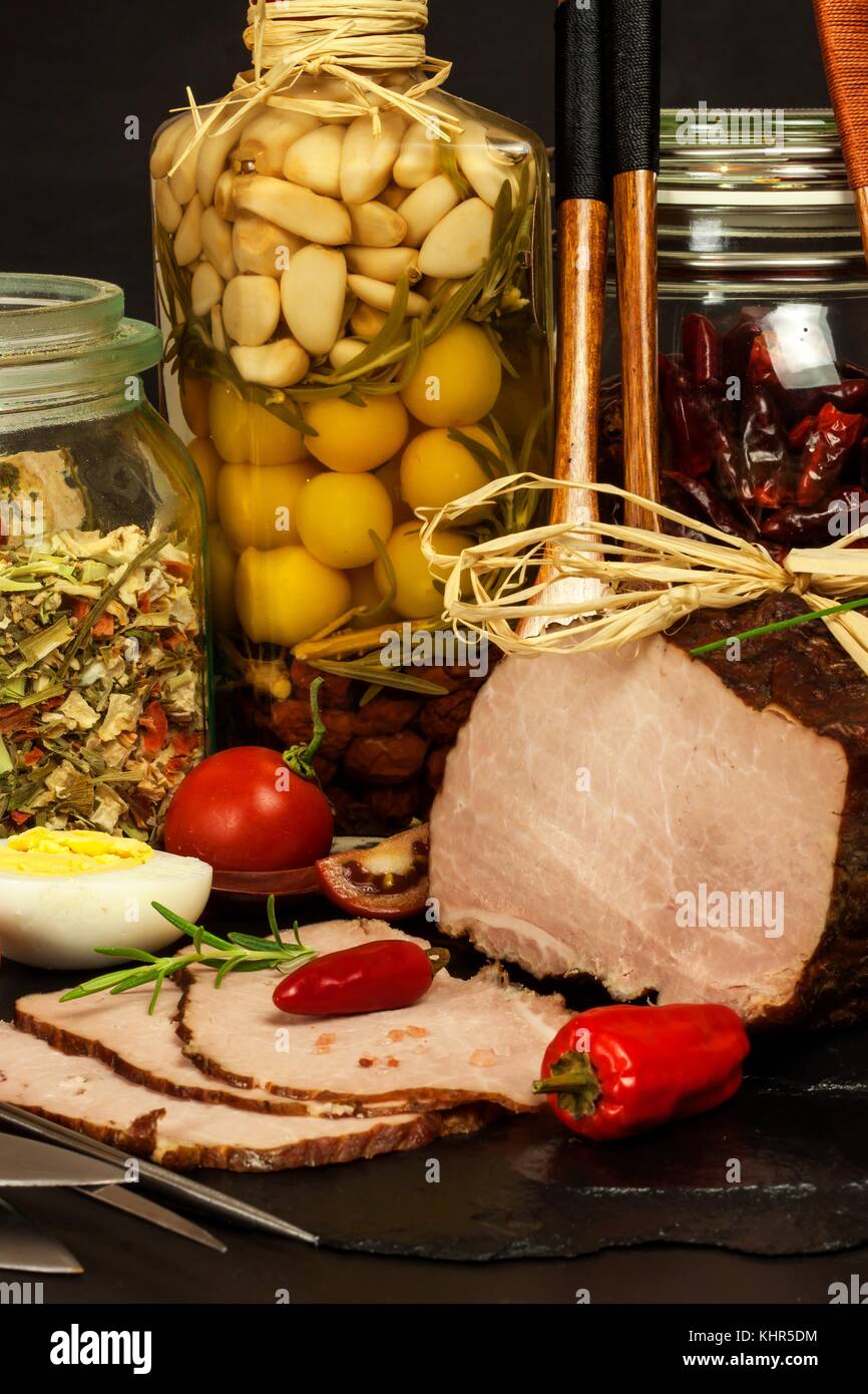 Traditional smoked meat on kitchen table. Culinary meat eating. Sales ...