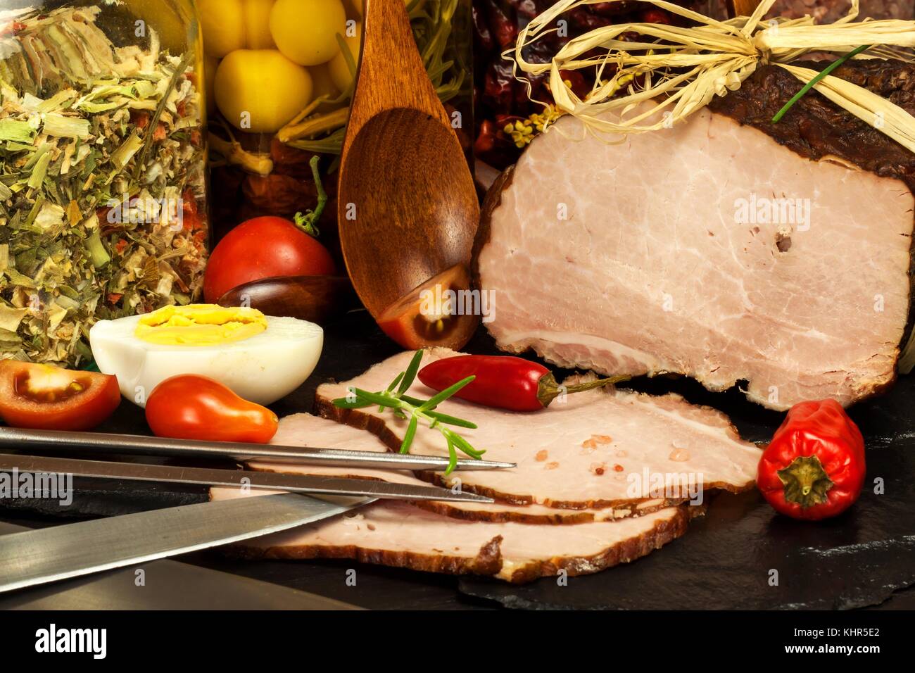 Traditional smoked meat on kitchen table. Culinary meat eating. Sales ...