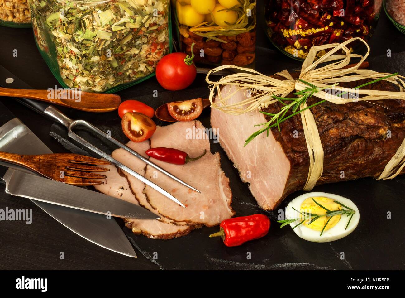 Traditional smoked meat on kitchen table. Culinary meat eating. Sales ...