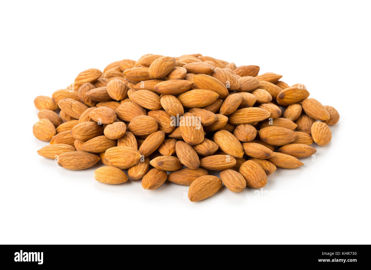 Heap of shelled almond kernels over white background Stock Photo - Alamy