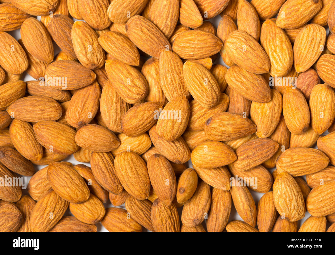 Fram filling, top view shelled almond kernels background Stock Photo ...