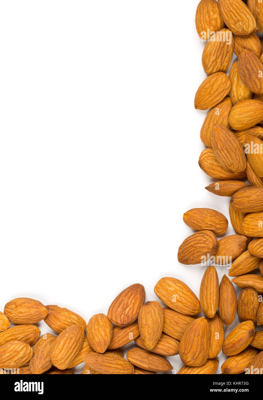 Shelled almond kernels border over white background Stock Photo - Alamy