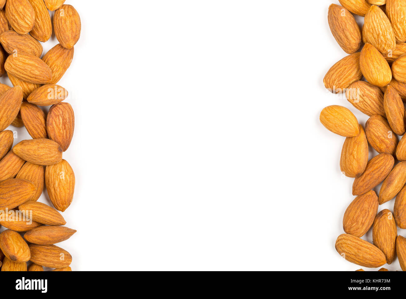 Shelled almond kernels border over white background Stock Photo - Alamy
