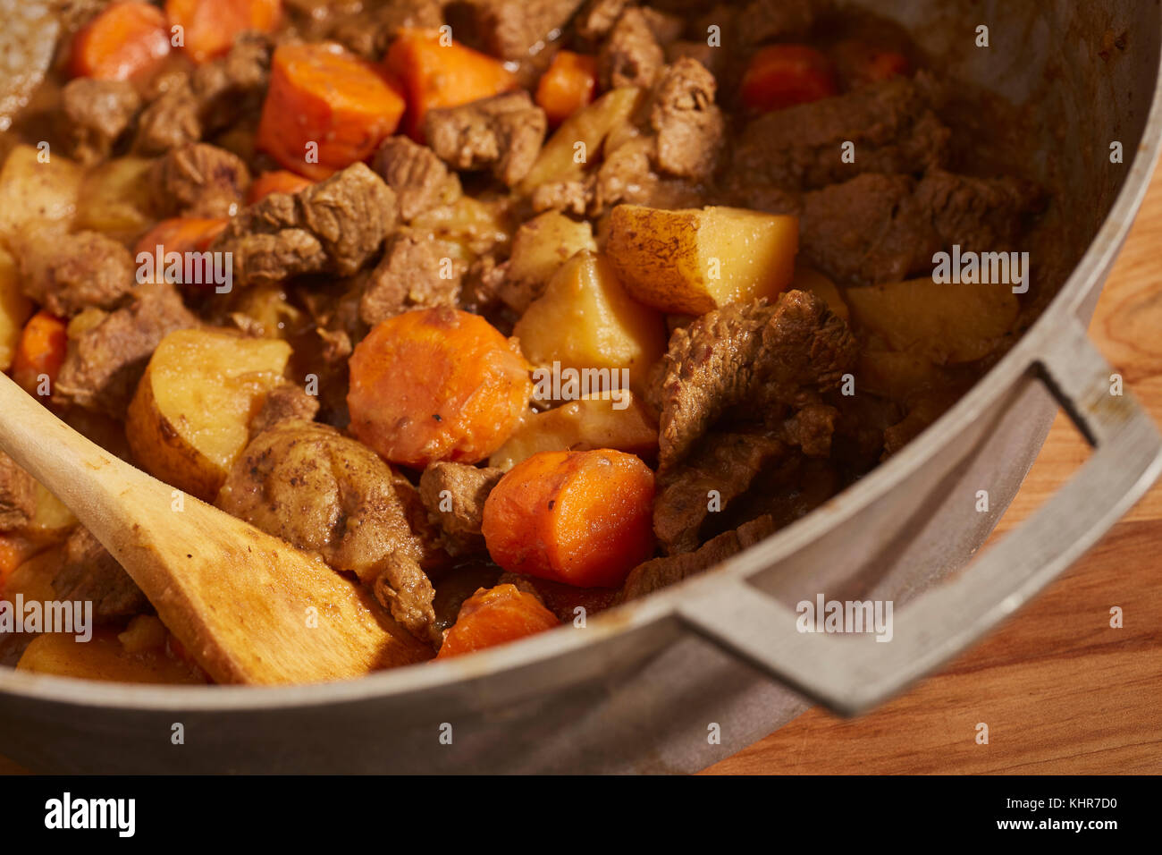 A pot of traditional American style beef stew with potatoes and carrots ...
