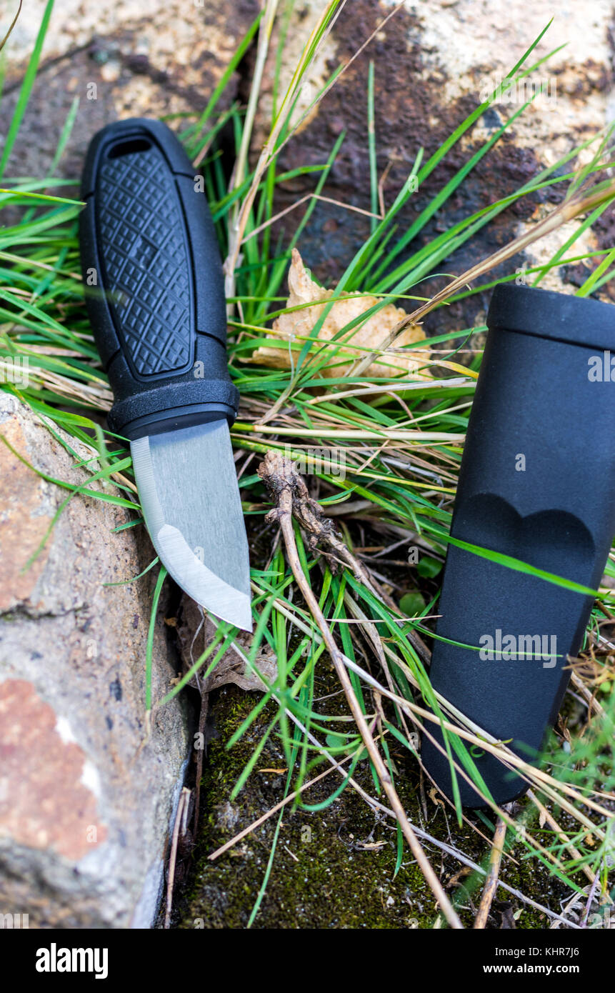 Swedish knife with a fixed blade. Vertical shot. Knife with a black ...