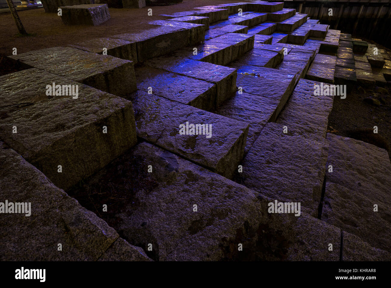 Stairs made of stones with blue light reflecting of them. Picture taken ...
