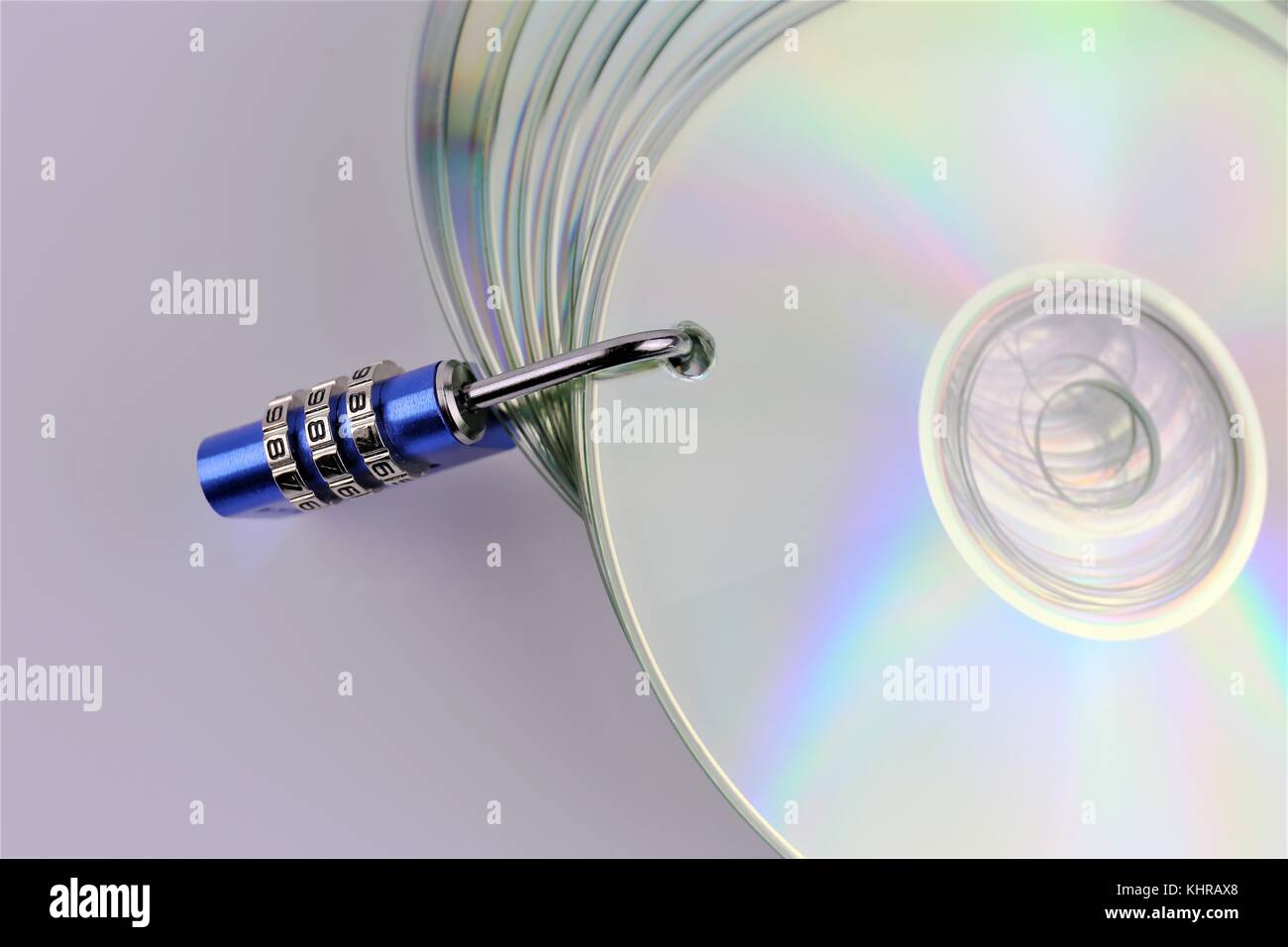 An concept Image of a cd and a lock - data security Stock Photo - Alamy