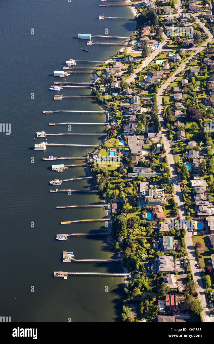 Aerial view on the luxury homes in Deep Cove by the Ocean Inlet. Taken ...