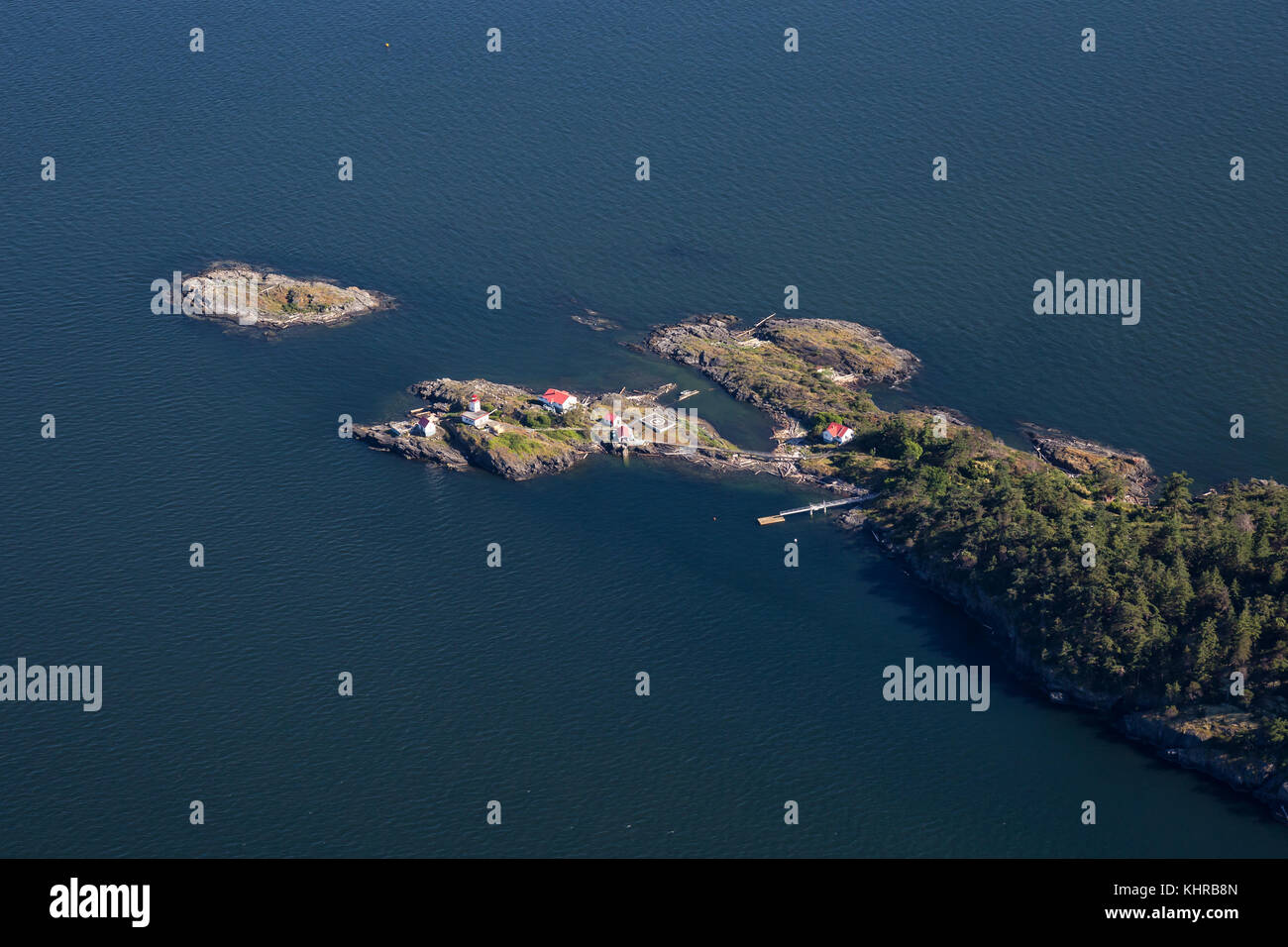 Merry Island with lighthouse, homes and a helipad near Sunshine Coast ...