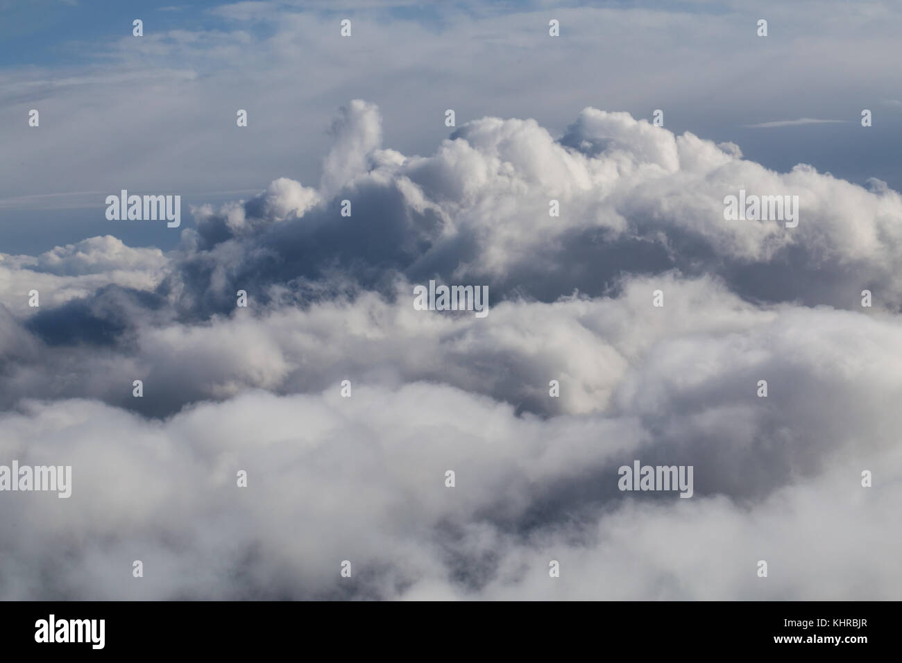 Above the clouds view of different cloud formations covering the remote ...
