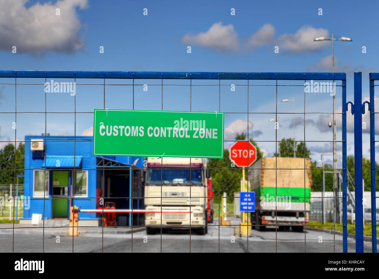 Lorries pass through the security checkpoint of the logistics complex ...